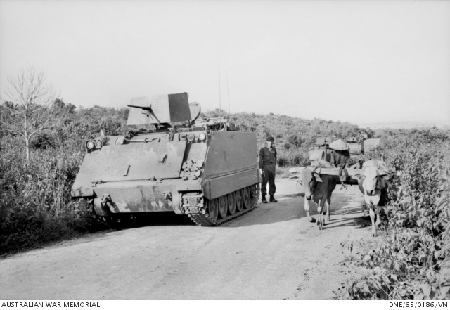 4 A Vietnamese ox-cart gives a wide berth to an Armoured Personnel ...