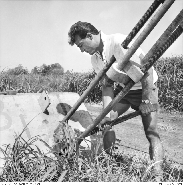 Ban Me Thuot, Vietnam. Aldo Pizzuti of Summer Hill, NSW, tightening guy ...