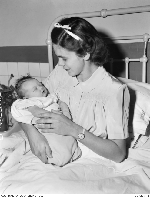 Mrs J W Callander admires her newly born daughter. Mrs Callander prior ...