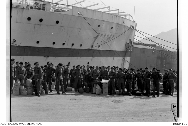 Unidentified British troops and sailors boarding the transport ship ...