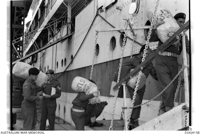 Unidentified British troops and sailors boarding the transport ship ...