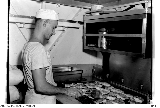 Unidentified crewman flipping rissoles in the galley of the Royal ...