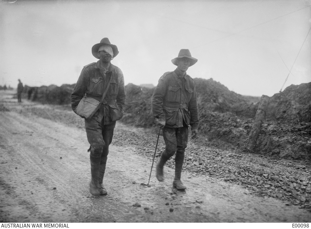 Two unidentified wounded Australian soldiers making their way along the ...
