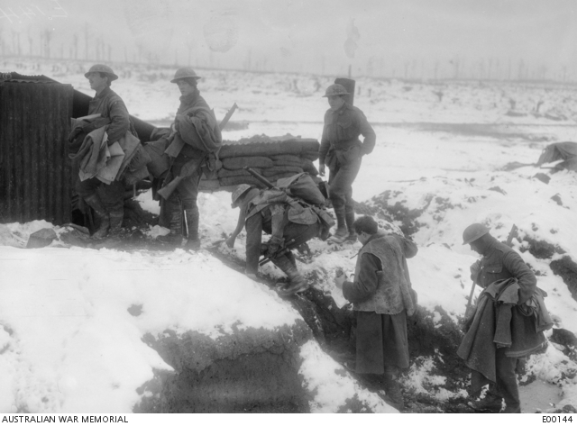 Unidentified Australian soldiers taking over snow covered dugouts in ...