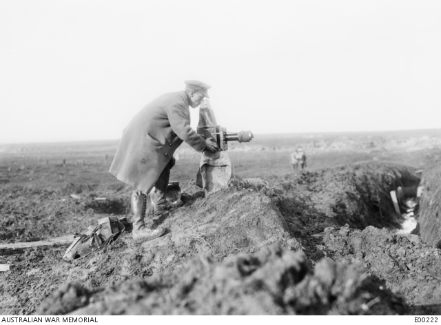 Lieutenant H Baldwin, Australian Official Photographer, taking a ...