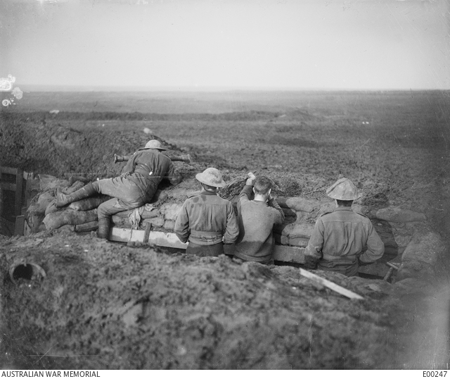Members of 3rd Australian Machine Gun Company watching the effect of ...