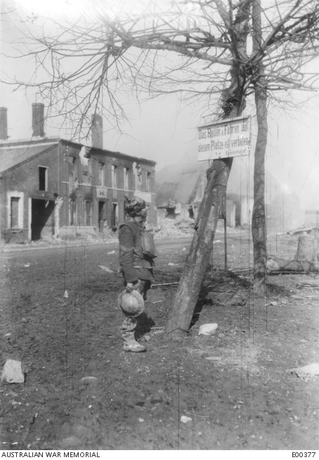 398 Corporal Geoffrey Cowen, of the 30th Battalion, wearing a captured ...