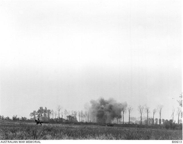 A German shell of heavy calibre bursting near an Anzac battery position ...