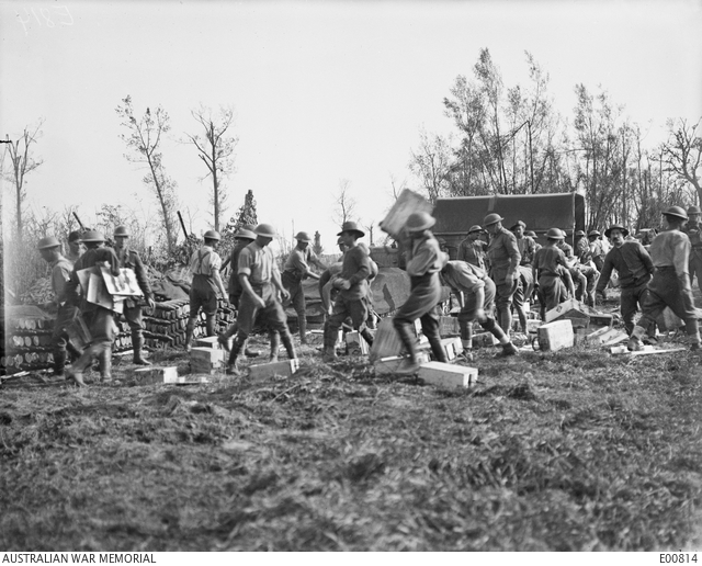 Australian soldiers unloading ammunition from a lorry at B group dump ...