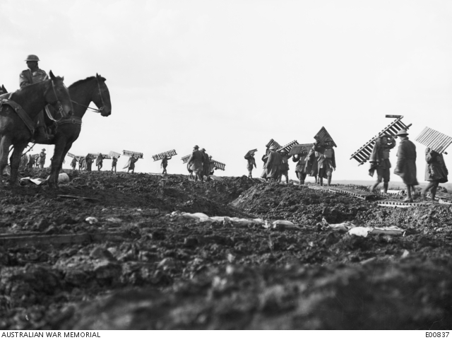 Pioneers of the 1st Division preparing a duckboard track over the muddy ...