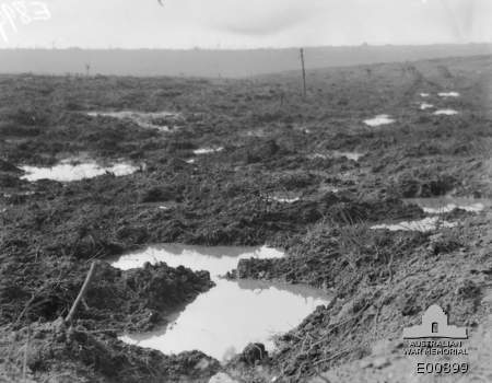 Water sodden shell craters and boggy gullies, over which the advance ...
