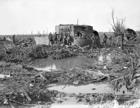 A group of unidentified soldiers standing beside a captured German ...