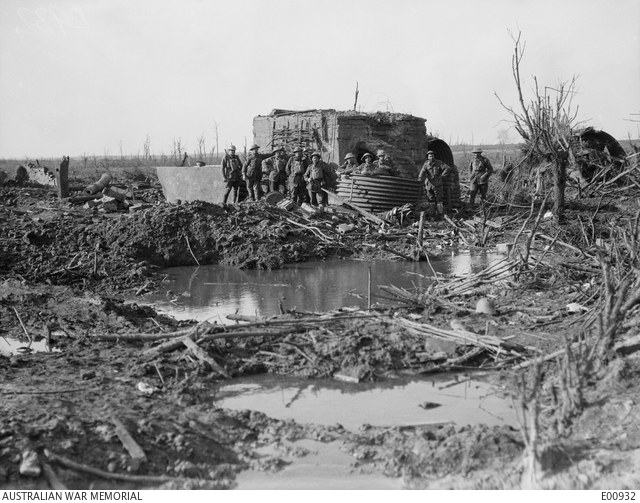 A group of unidentified soldiers standing beside a captured German ...