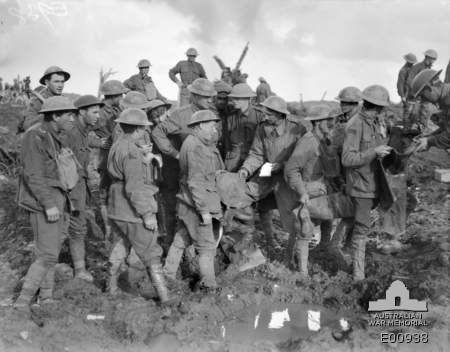 Field Artillery personnel being issued with trench waders for working ...
