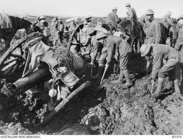 Members of the Australian 1st Division Pioneers digging out a gun ...