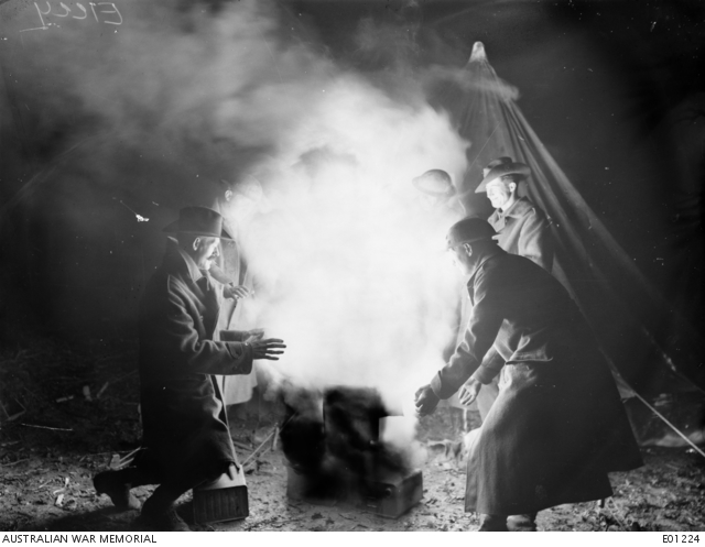 The camp fire, smoky but warm, is enjoyed by Australian soldiers ...