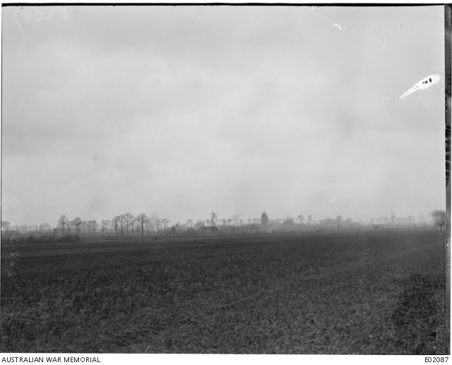A village in Northern France, partially obscured by the smoke from the ...