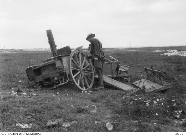 An unidentified soldier inspects a captured German cooker just behind ...
