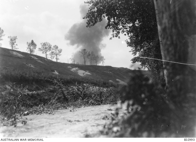 Smoke from a dump of ammunition, which exploded near the 9th Battalion ...