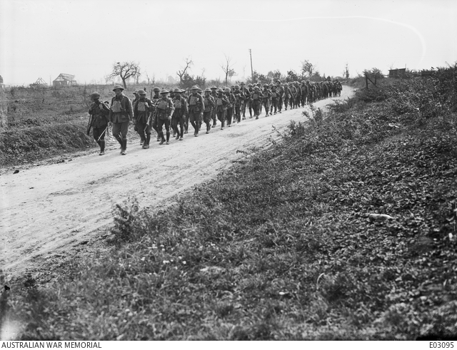 Troops of the 28th Battalion marching to the front line. On this date ...
