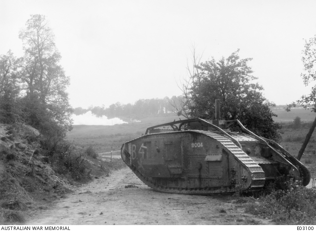 View of a damaged British Mark V Male tank with the numbers '9004' and ...
