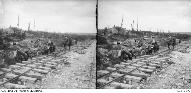 Medical Details of the 22nd Battalion, passing along the old German ...