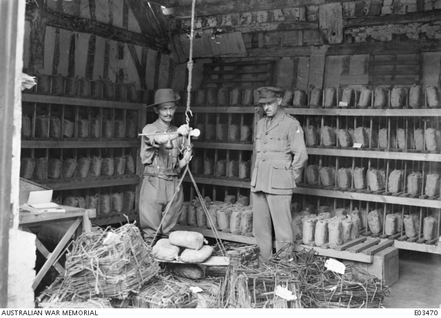 Corporal Bennett (left), checking and stacking a shipment of yeast at ...