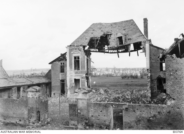 A two storey building largely destroyed apart from each side and a ...