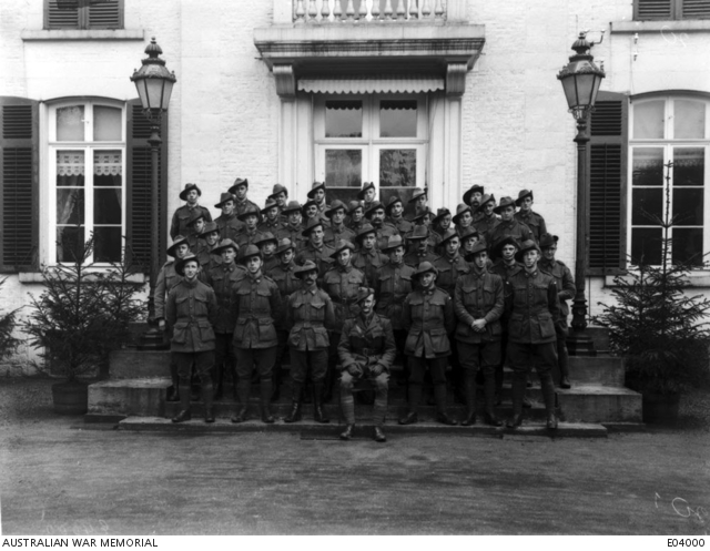 An outdoors group portrait of the Camp Commandant and Headquarters ...