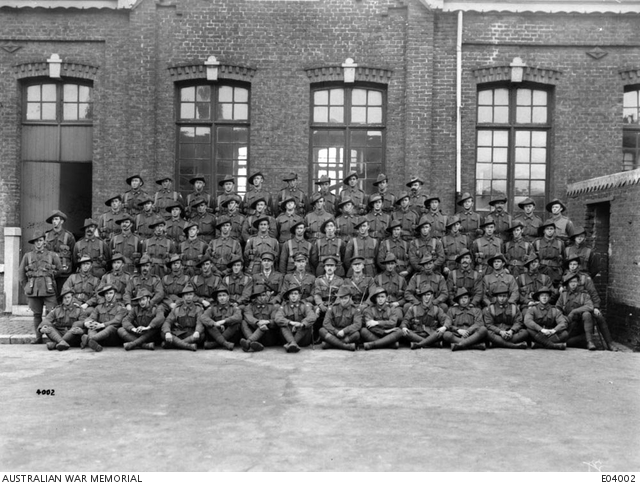 An outdoors group portrait of unidentified members of C Company of the ...