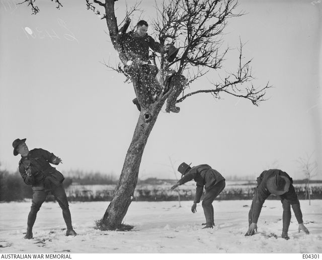Three unidentified Australian soldiers, in a snow covered field, making ...