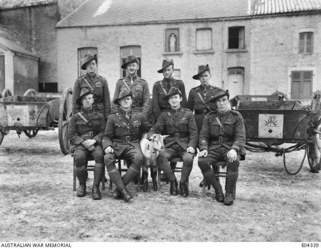 An outdoors group portrait of eight well-known members of the 22nd ...