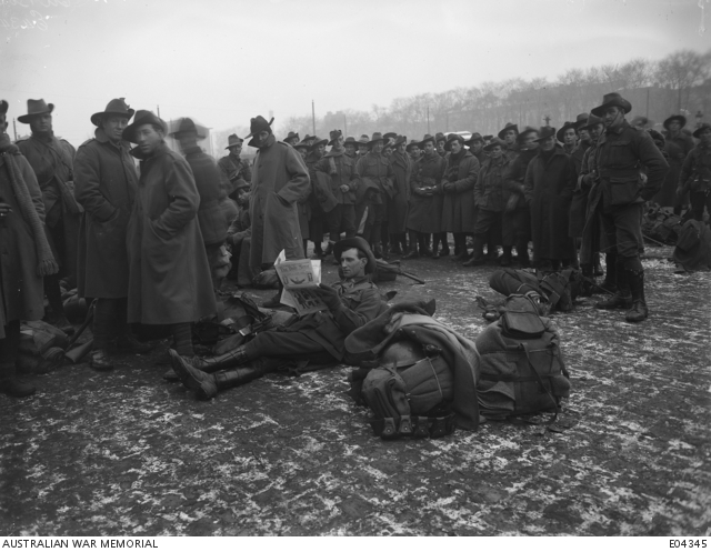 Unidentified men of the 2nd Australian Division, awaiting entrainment ...