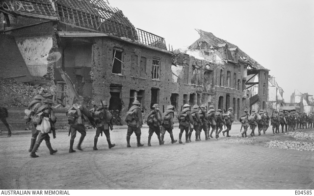Unidentified troops of the 2nd Australian Division moving up in single ...