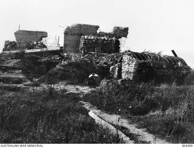 The remains of a damaged German stronghold. The stronghold is ...