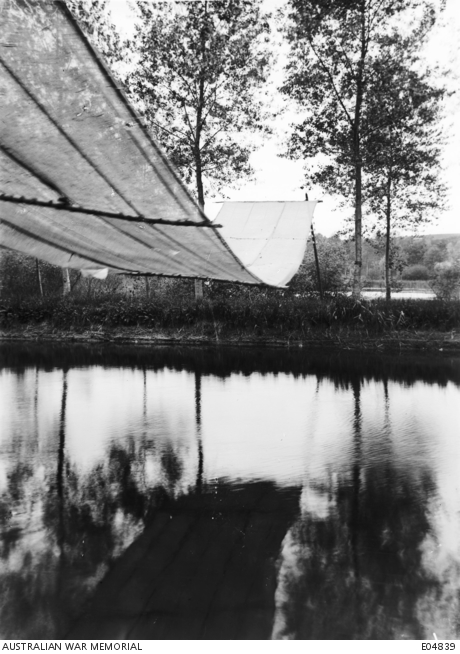 A close-up view of a dummy 'bridge', made of camouflage netting strung ...