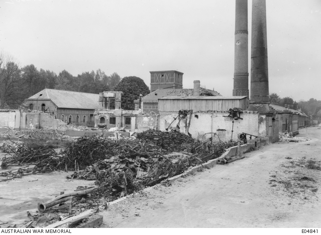 The ruins of the heavily shell damaged mill. Note the metal debris ...