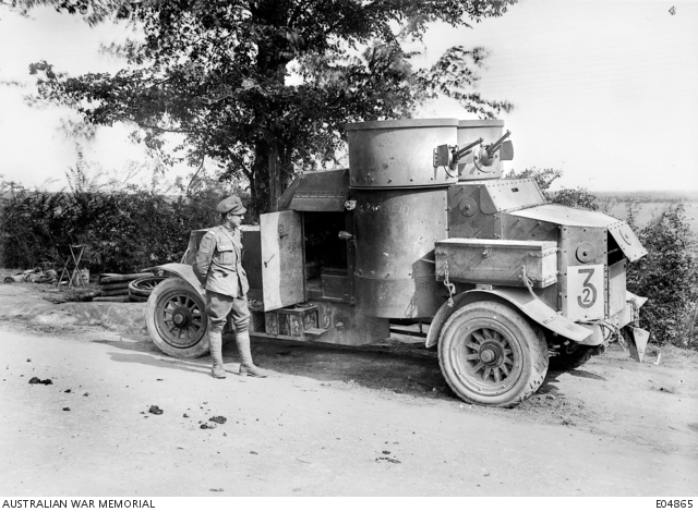 An unidentified member of the Tank Corps standing next to a new type of ...