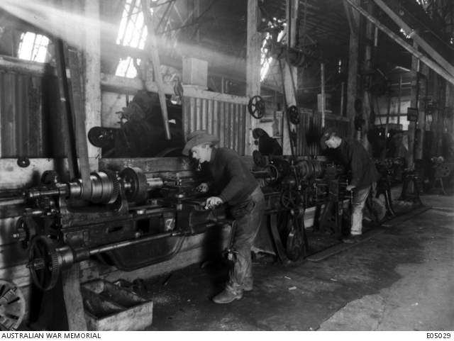 Two unidentified students working at lathes in the fitters' machine ...