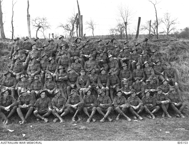 An outdoors group portrait of members of the 3rd Machine Gun Battalion ...
