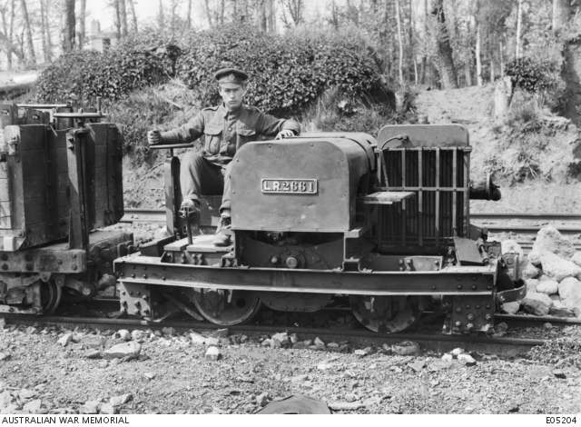An unidentified British soldier sitting in the driver's seat of a ...