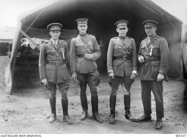Outdoor group portrait of four officers. Identified from left to right ...