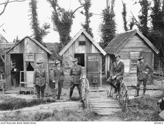 An informal group portrait of five unidentified officers of No 5 ...