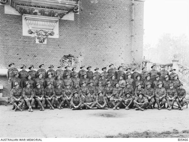 An outdoors group portrait of unidentified staff of the Headquarters of ...
