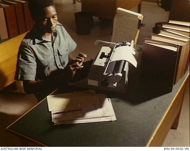 South Vietnam. 1969. Pacific Islands Regiment clerk using a typewriter ...