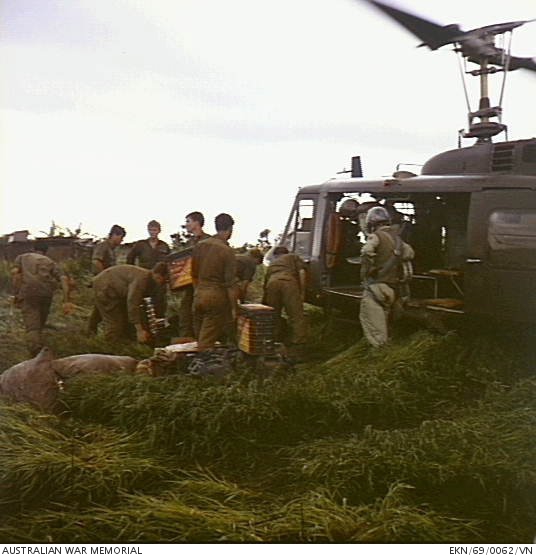 South Vietnam. 1969. Soldiers in the field unloading supplies from an ...