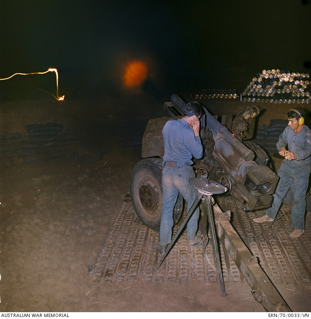 A 105mm howitzer gun of 101st Field Battery flashes in the night during ...