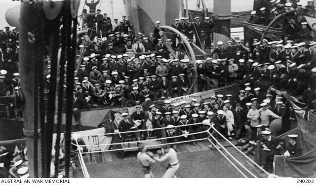 Sailors and officers watch a bout in the Light Cruiser Boxing ...