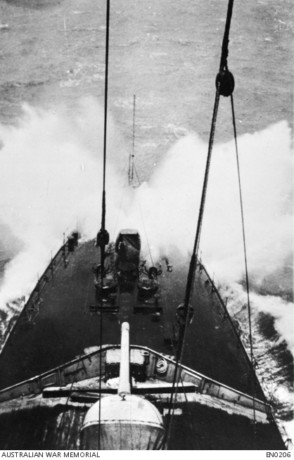 Aerial view of the fore deck of HMAS Sydney, sea spray covering the bow ...