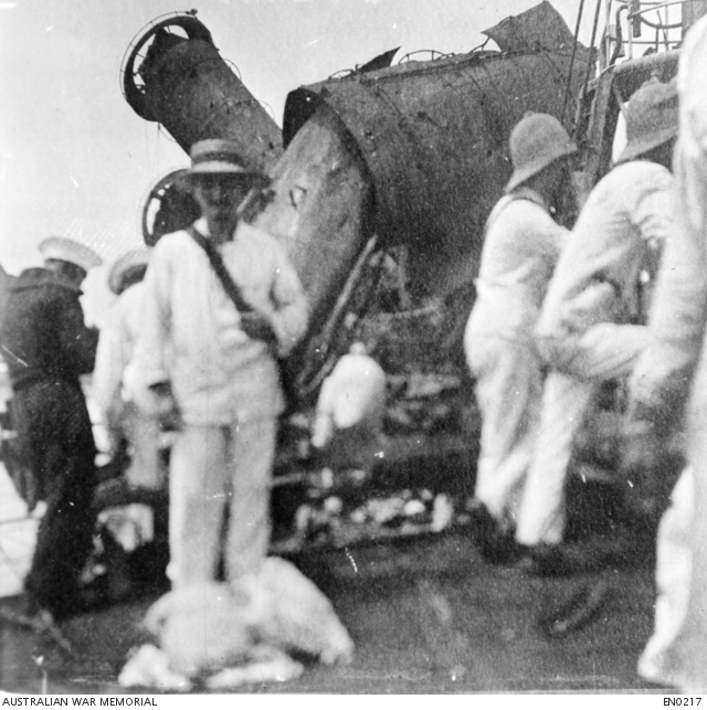 Several unidentified men amid the wrecked funnels and superstructure on ...